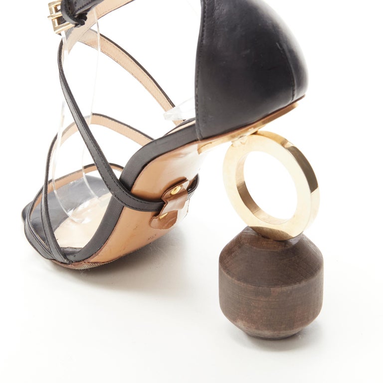 JACQUEMUS Runway architectural wood block gold ring black strappy heel ...