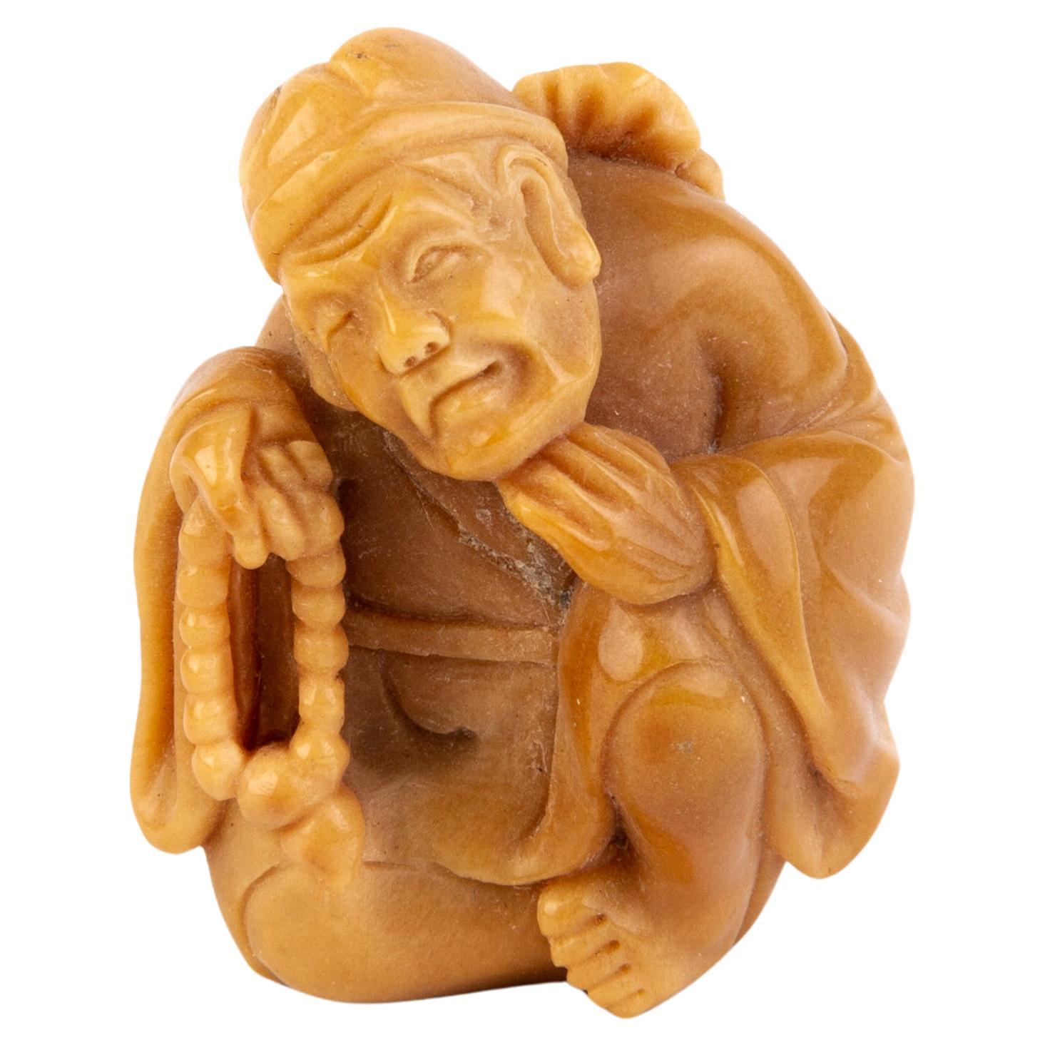 Japanese Carved Tagua Nut Netsuke Inro of a Merchant For Sale at 1stDibs