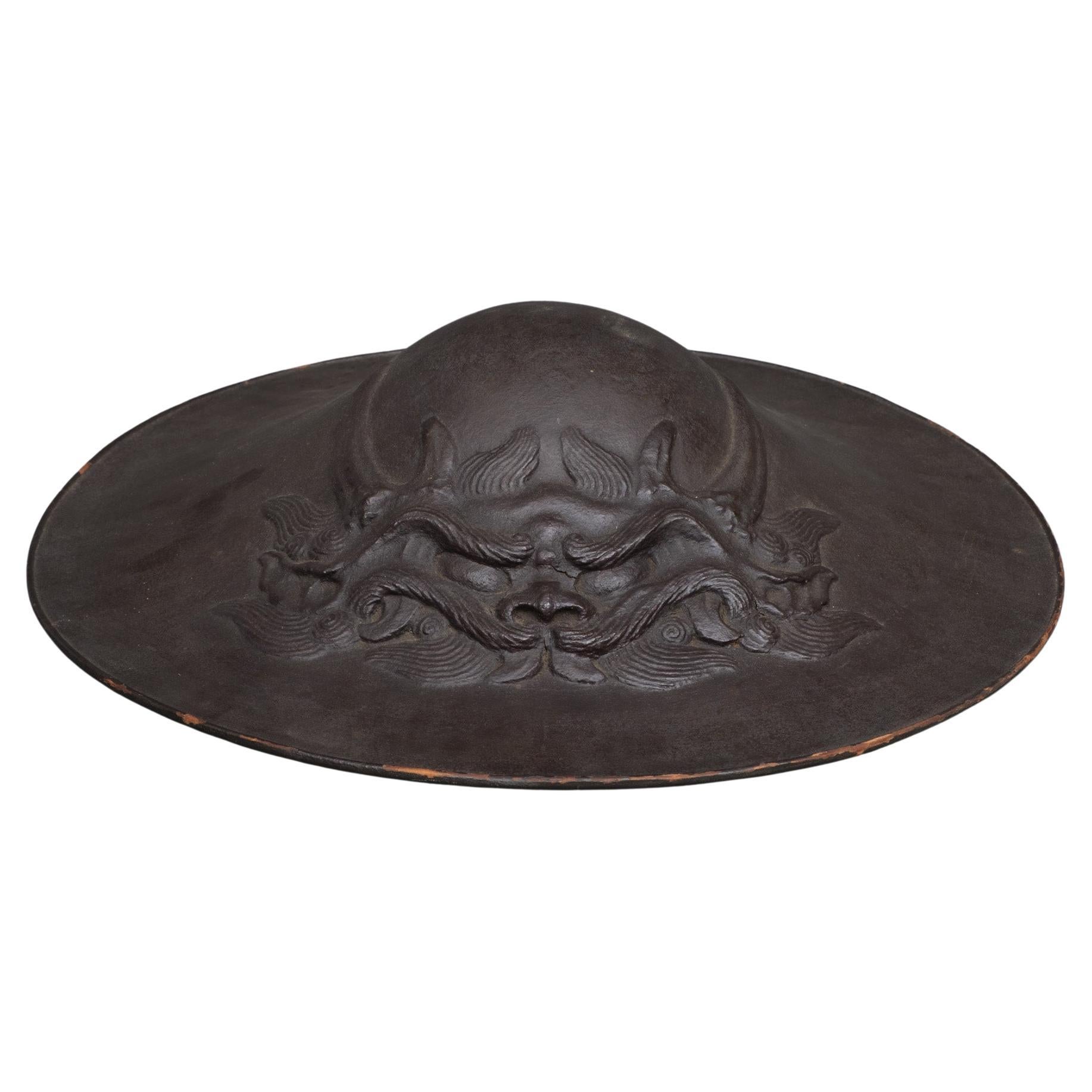 Japanese lacquer jingasa 陣笠 with a high relief design of a temple lion ...