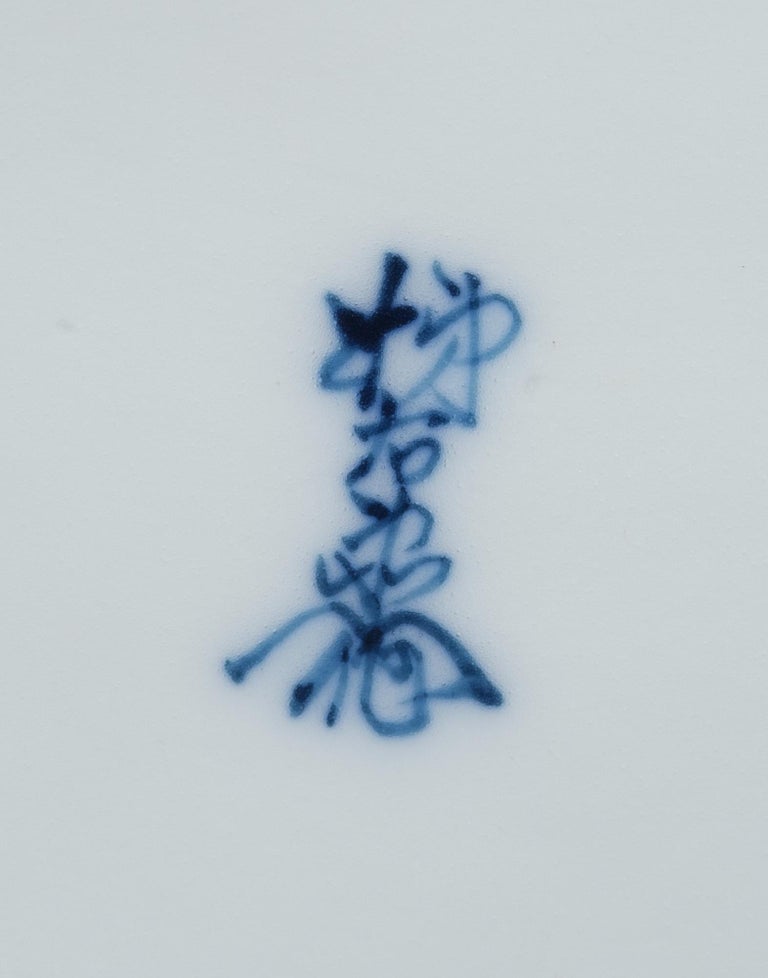 Japanese porcelain okimono 置物 of a sitting child, by Sakaida Kakiemon ...