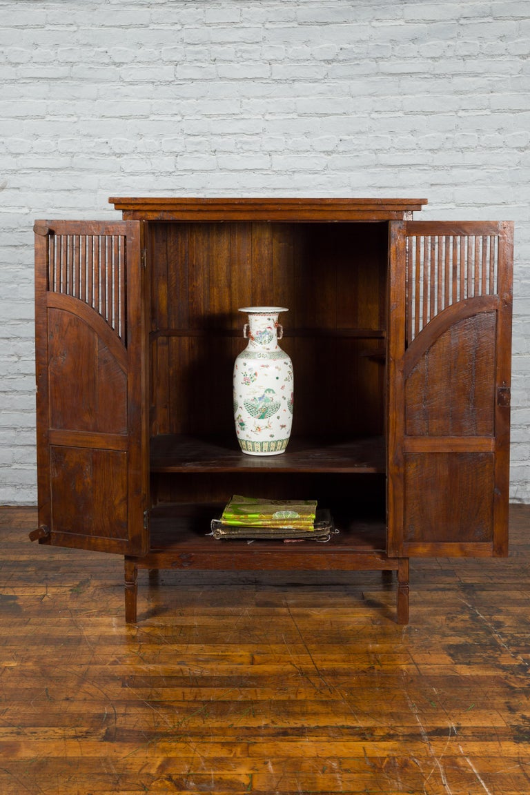 Javanese Antique Teak Armoire with Slatted Motifs, Tapered Feet and ...