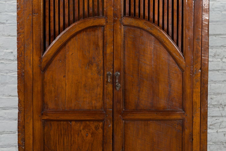 Javanese Antique Teak Armoire with Slatted Motifs, Tapered Feet and ...