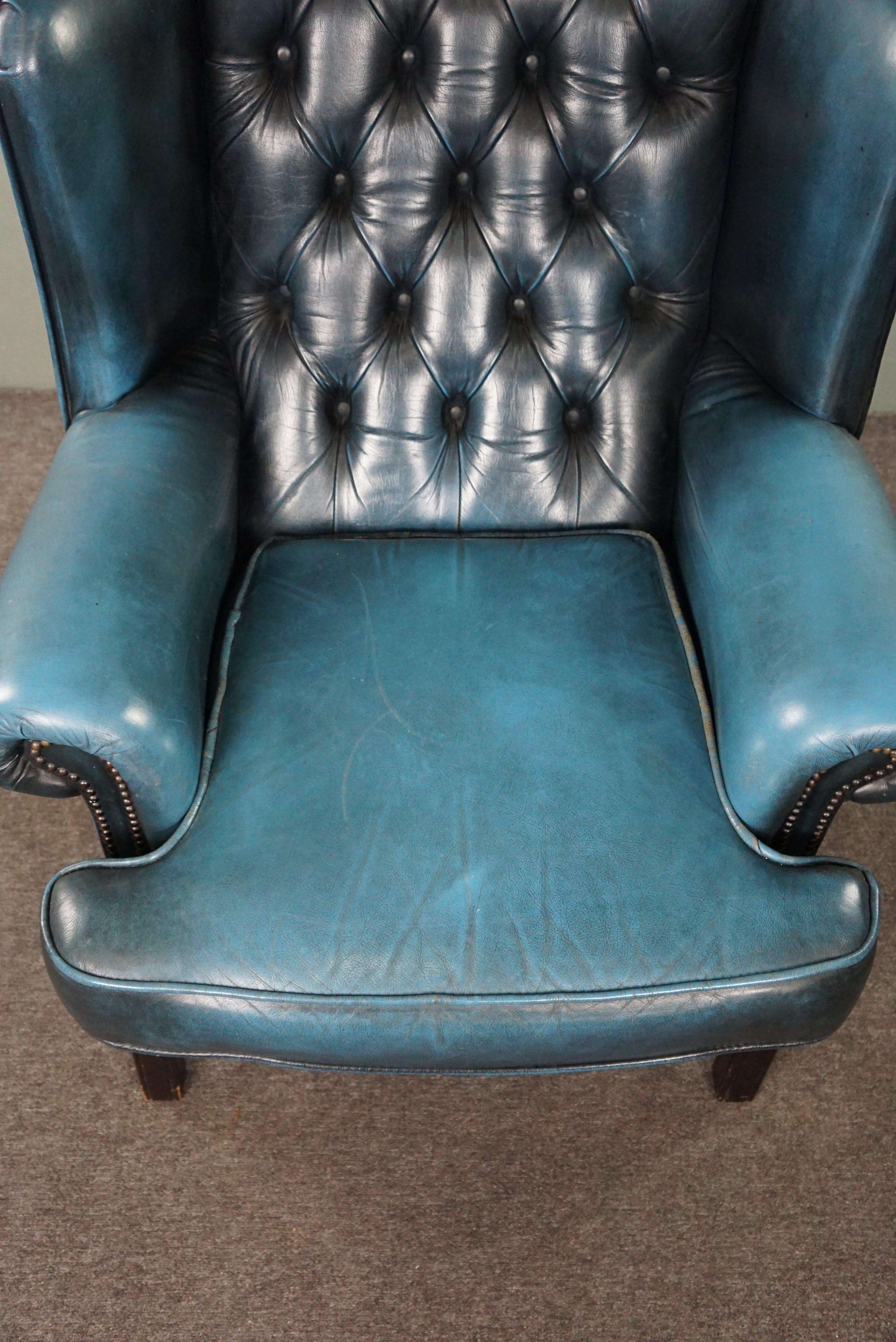 Jeans blue leather English Chesterfield wingback armchair with ottoman ...