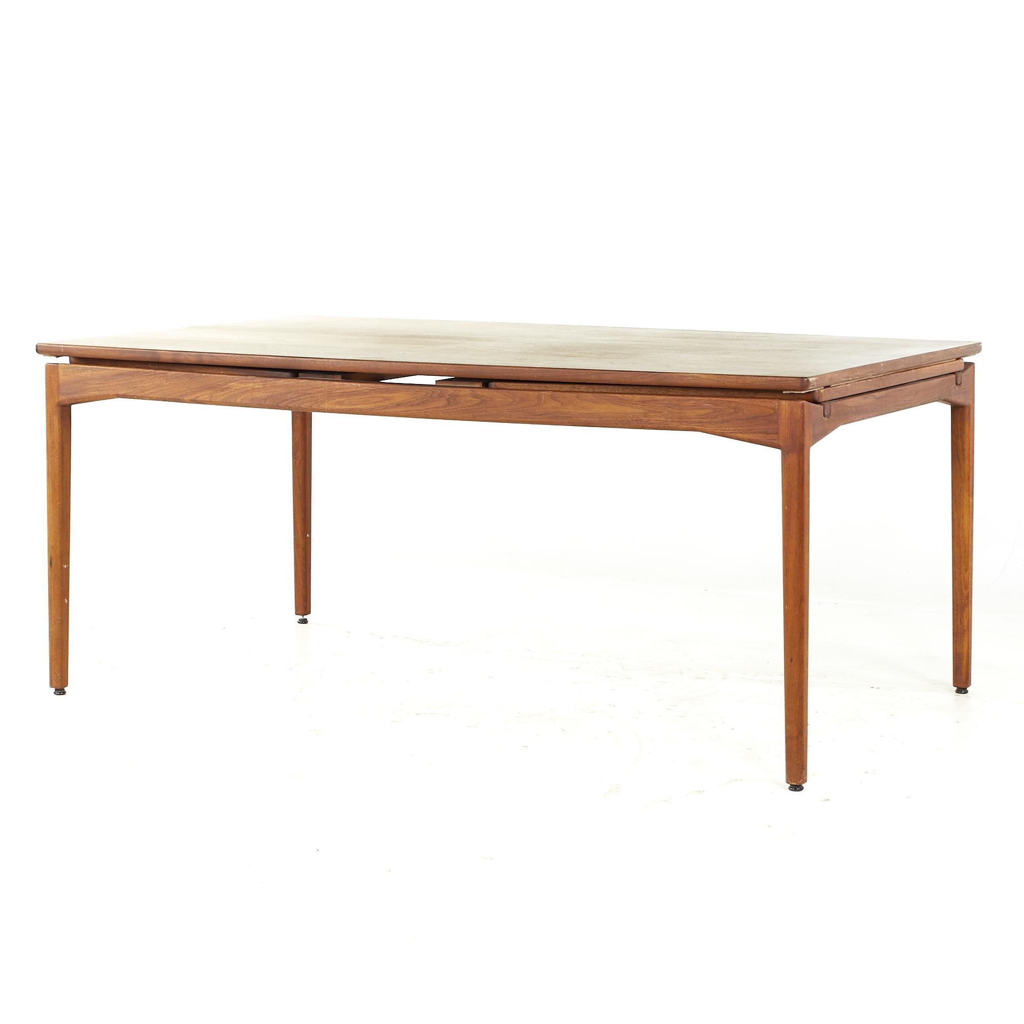 Jens Risom Midcentury Walnut Hidden Leaf Expanding Dining Table For Sale at 1stDibs