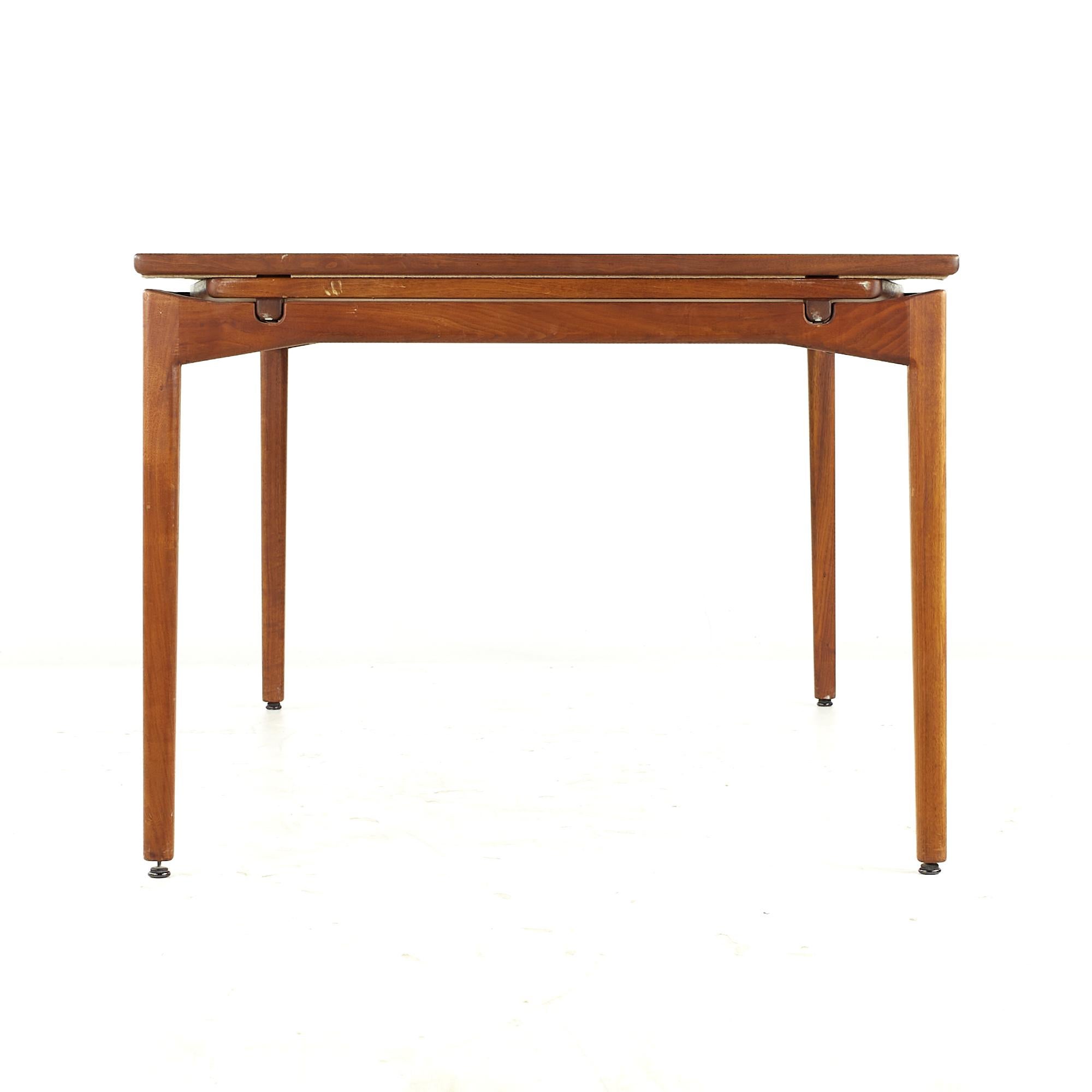 Jens Risom Midcentury Walnut Hidden Leaf Expanding Dining Table For Sale at 1stDibs