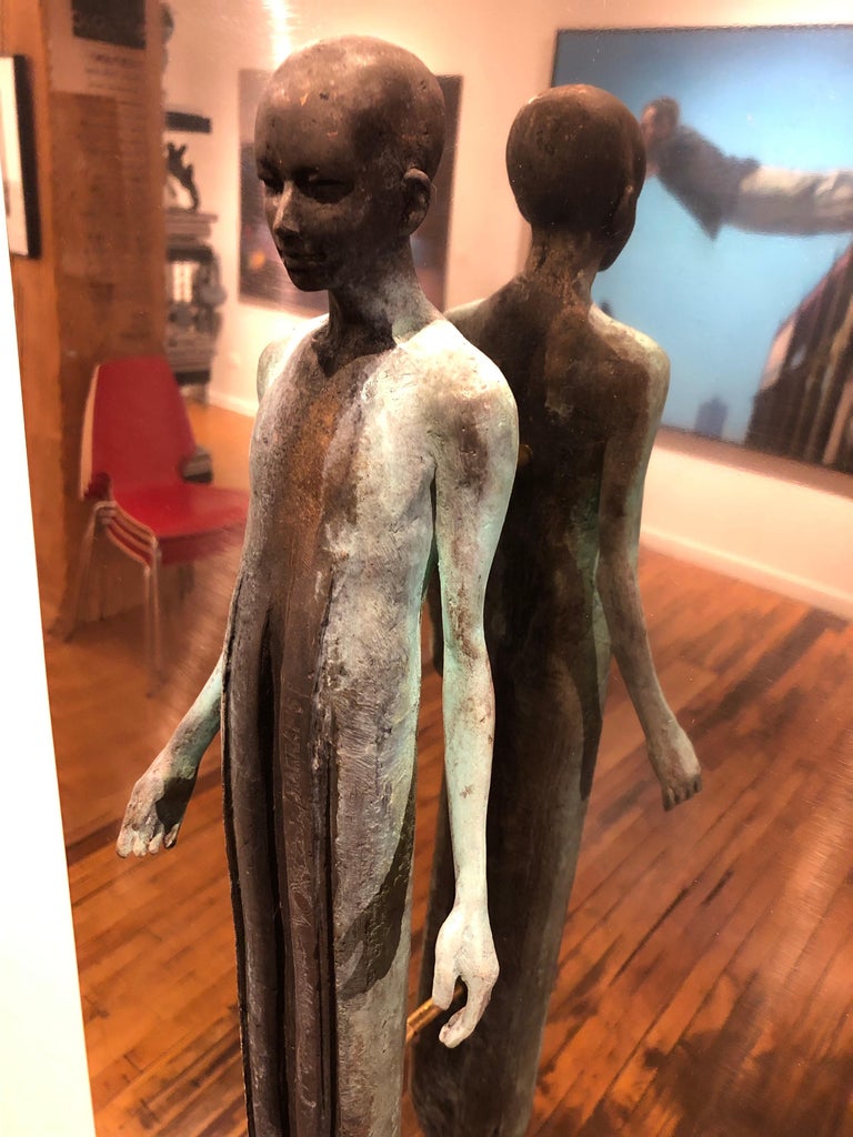 Jesus Curia Perez - Library - Bronze Wall Sculpture Floats in Front of ...