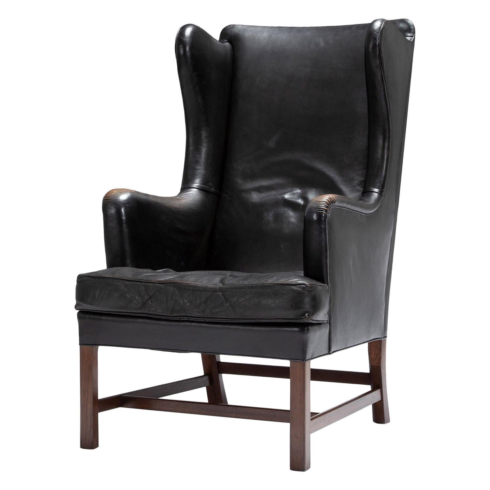 Curved Wingback Chair at 1stDibs