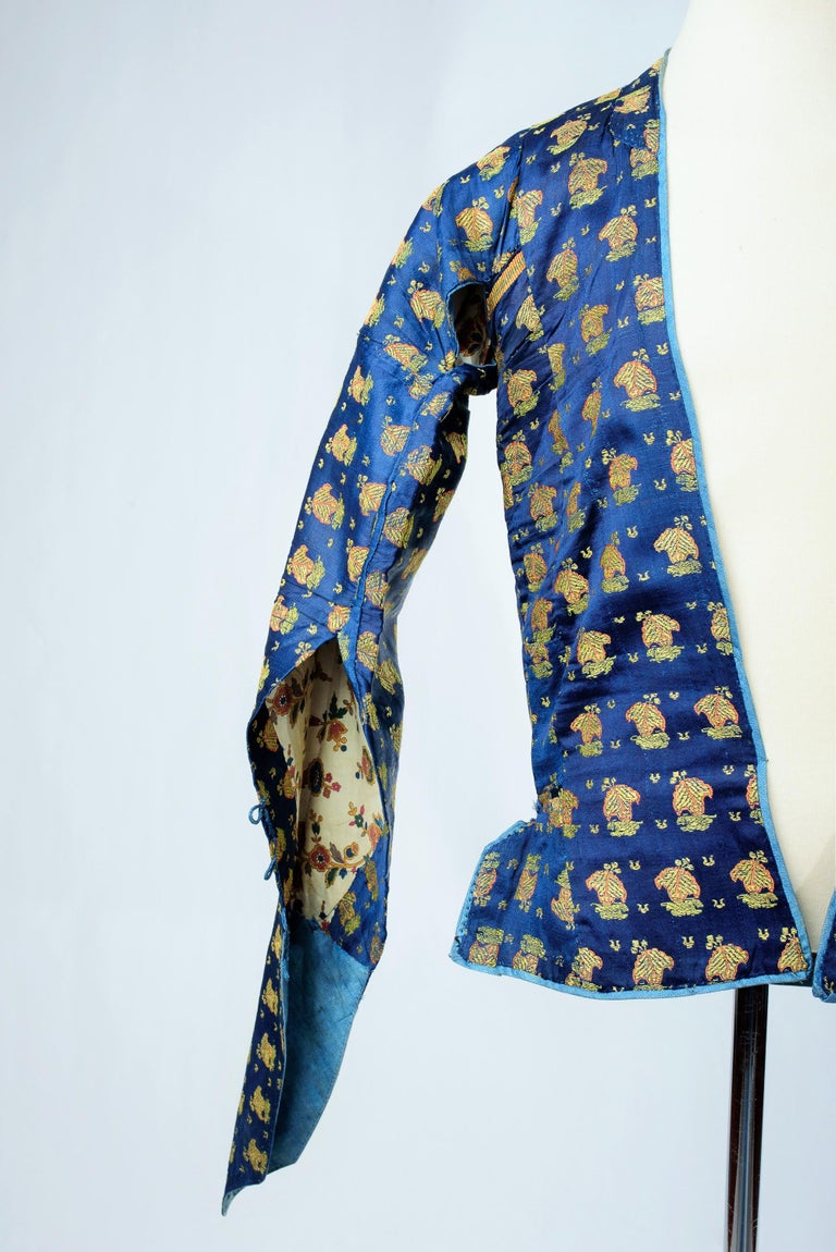 A Persian Jacket in Brocaded Lampas and Printed cotton lining Kadjar ...