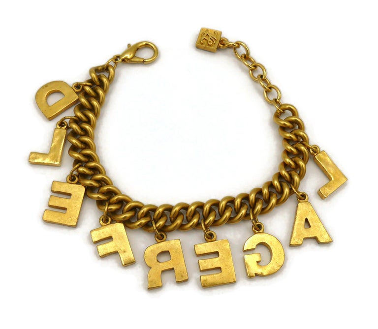 KARL LAGERFELD Vintage Gold Tone Lettering Charm Bracelet For Sale at ...