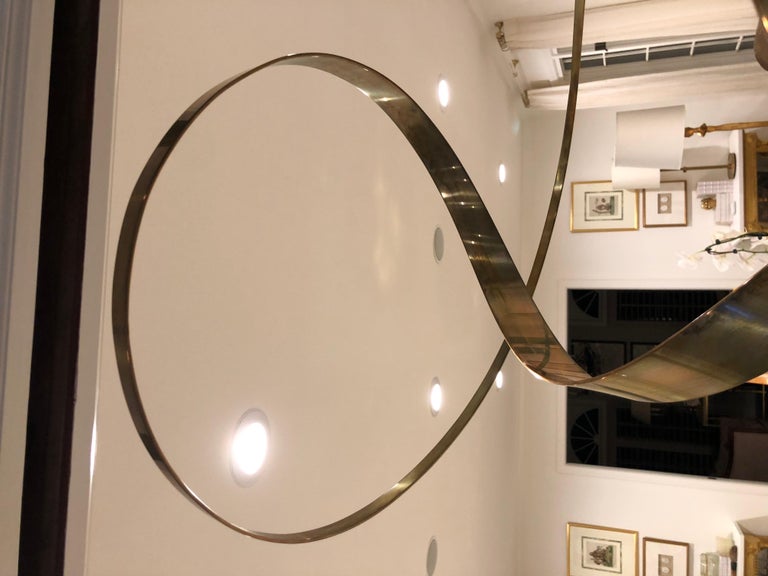 Kinetic Brass Ribbon Sculpture Set on a Tall Metal Stand in the style ...