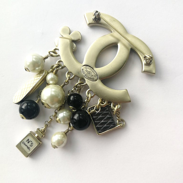 Large black enamelled and silvered metal Double C 'charm' brooch ...
