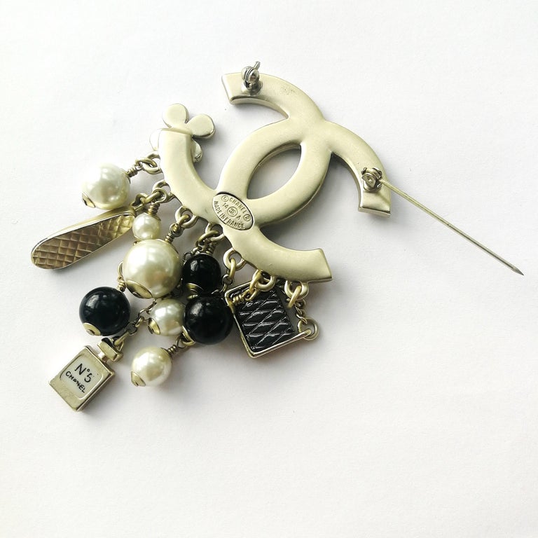 Large black enamelled and silvered metal Double C 'charm' brooch ...