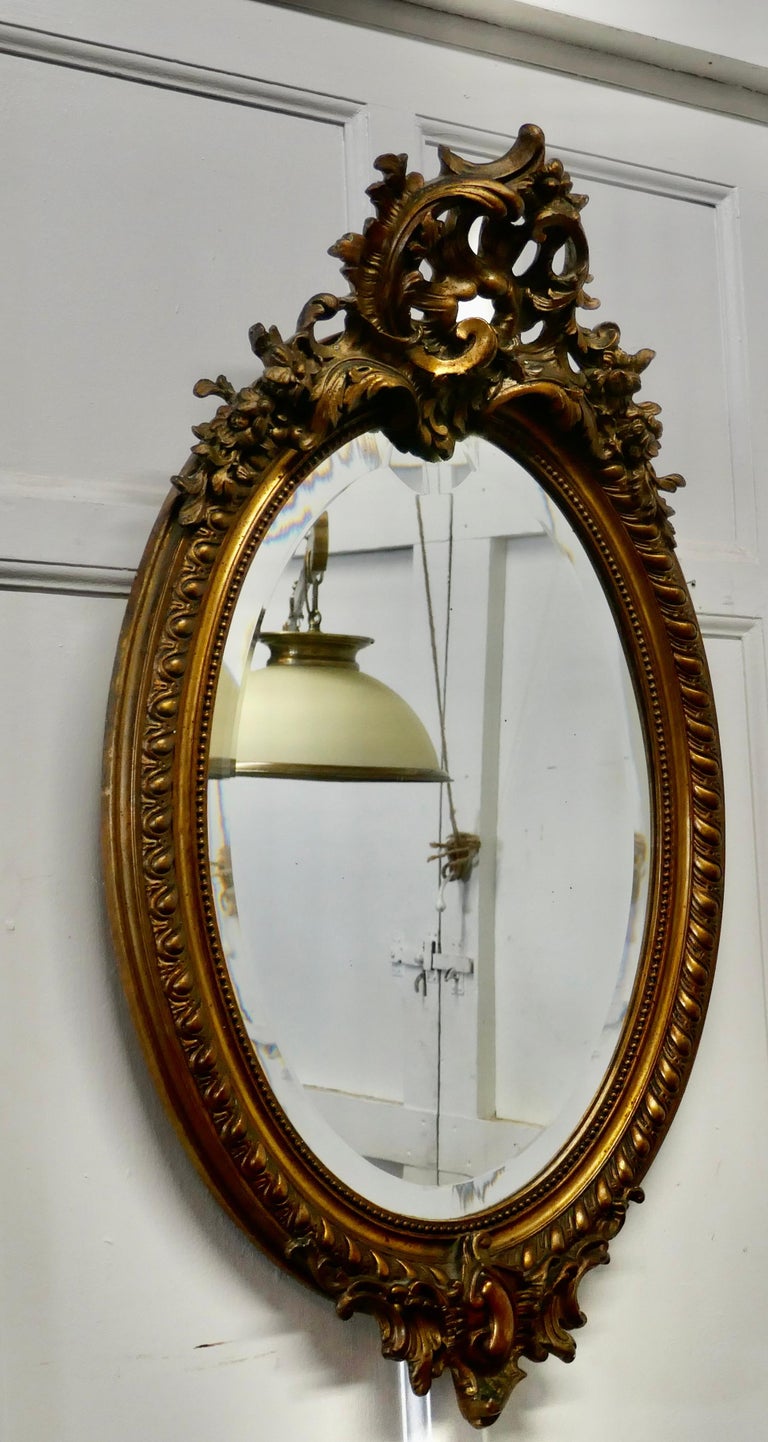 Large French Rococo Oval Gilt Wall Mirror For Sale at 1stDibs
