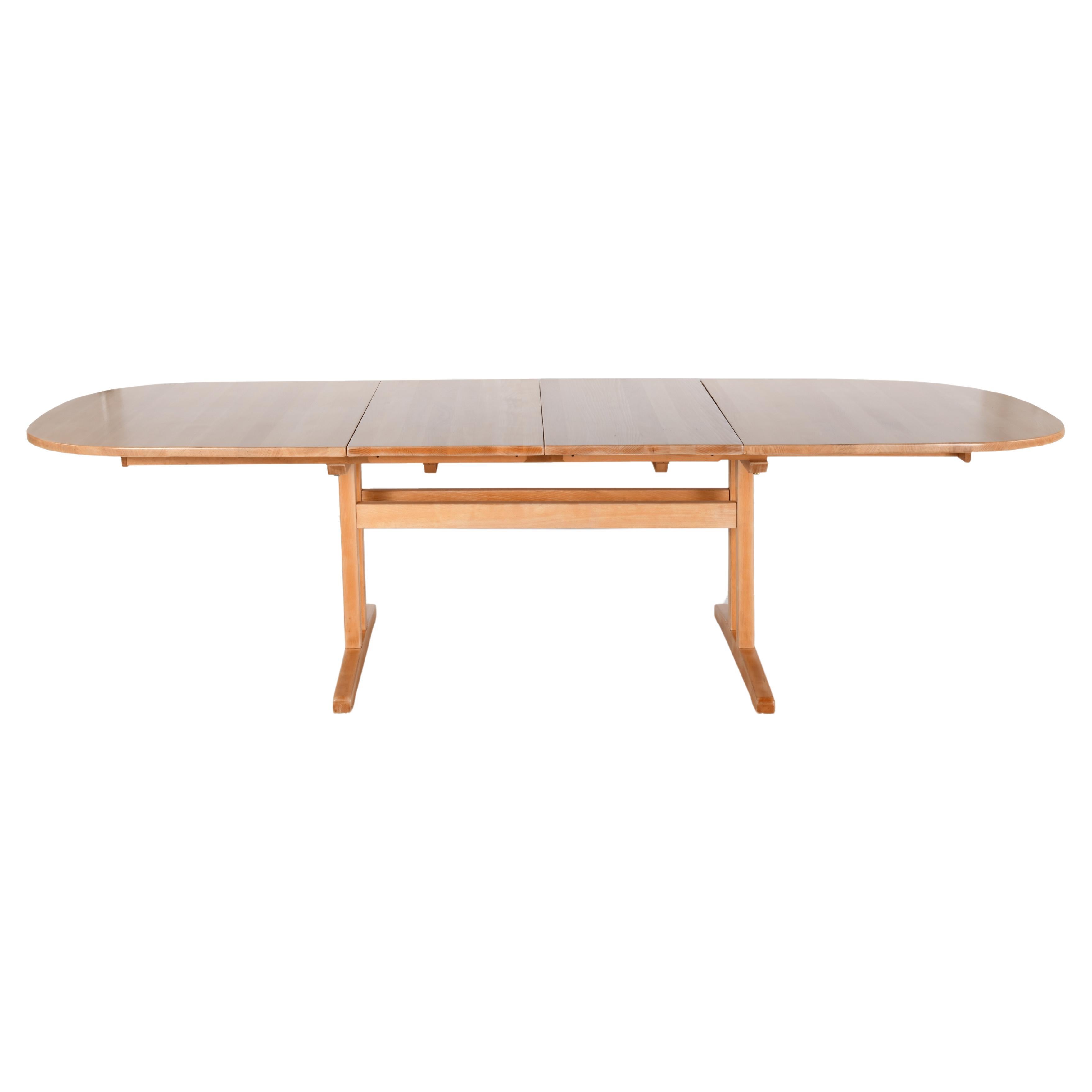 Large solid beech oval table with sliding top and two extensions. For ...
