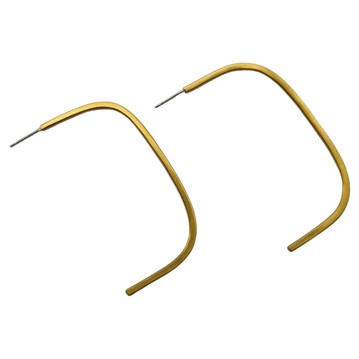 Large staple earrings in golden brass For Sale at 1stDibs