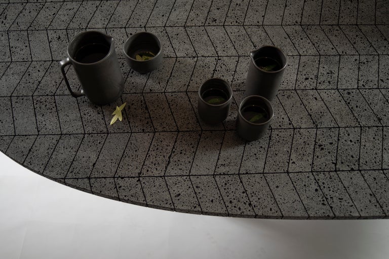Lava Oval Table, Volcanic Rock and Black Stainless Steel at 1stDibs