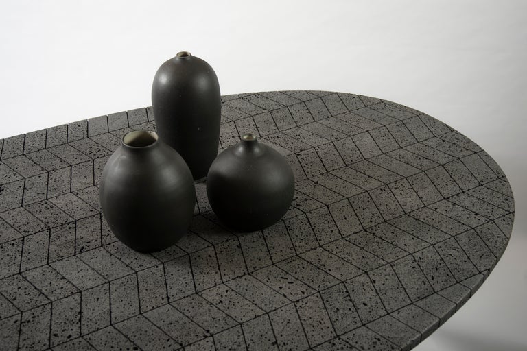 Lava Oval Table, Volcanic Rock and Black Stainless Steel at 1stDibs