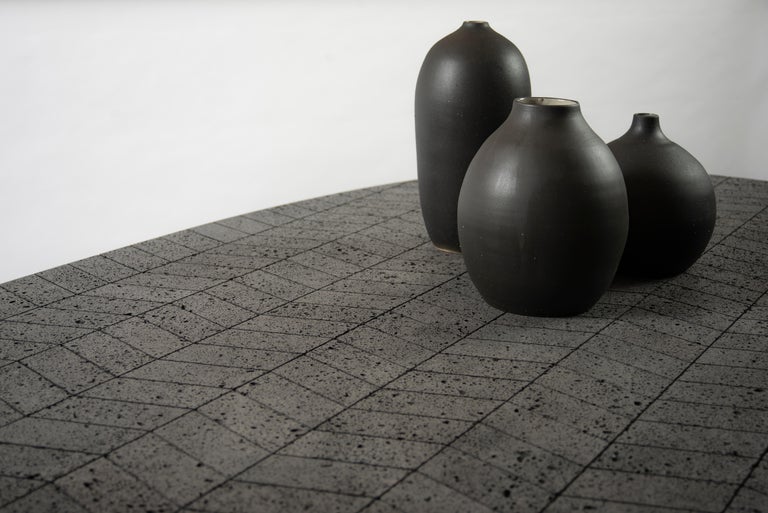 Lava Oval Table, Volcanic Rock and Black Stainless Steel at 1stDibs