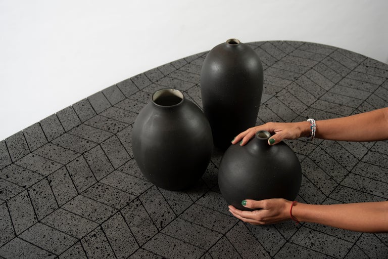 Lava Oval Table, Volcanic Rock and Black Stainless Steel at 1stDibs