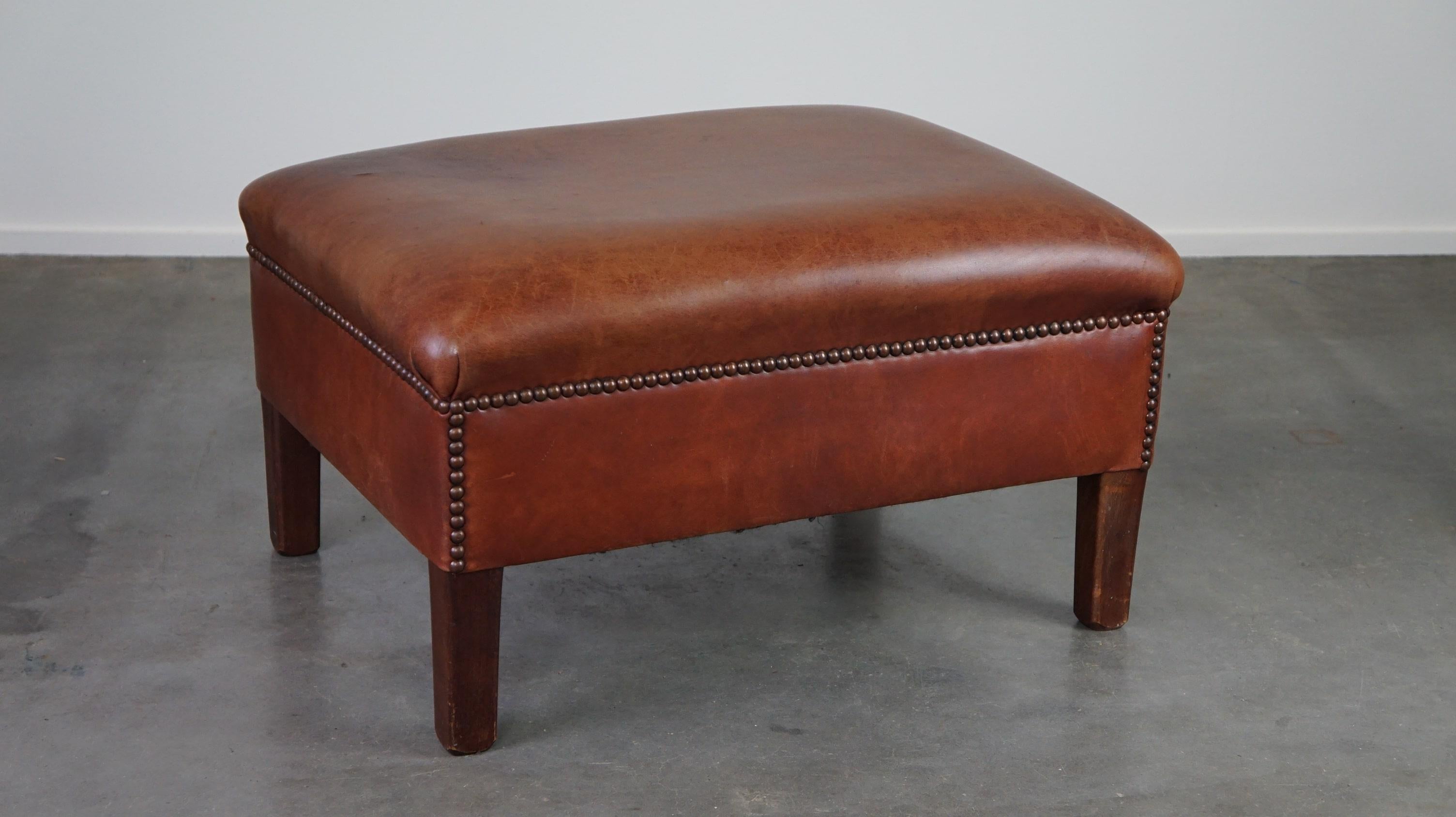 Leather ottoman in classic English style finished with decorative nails ...