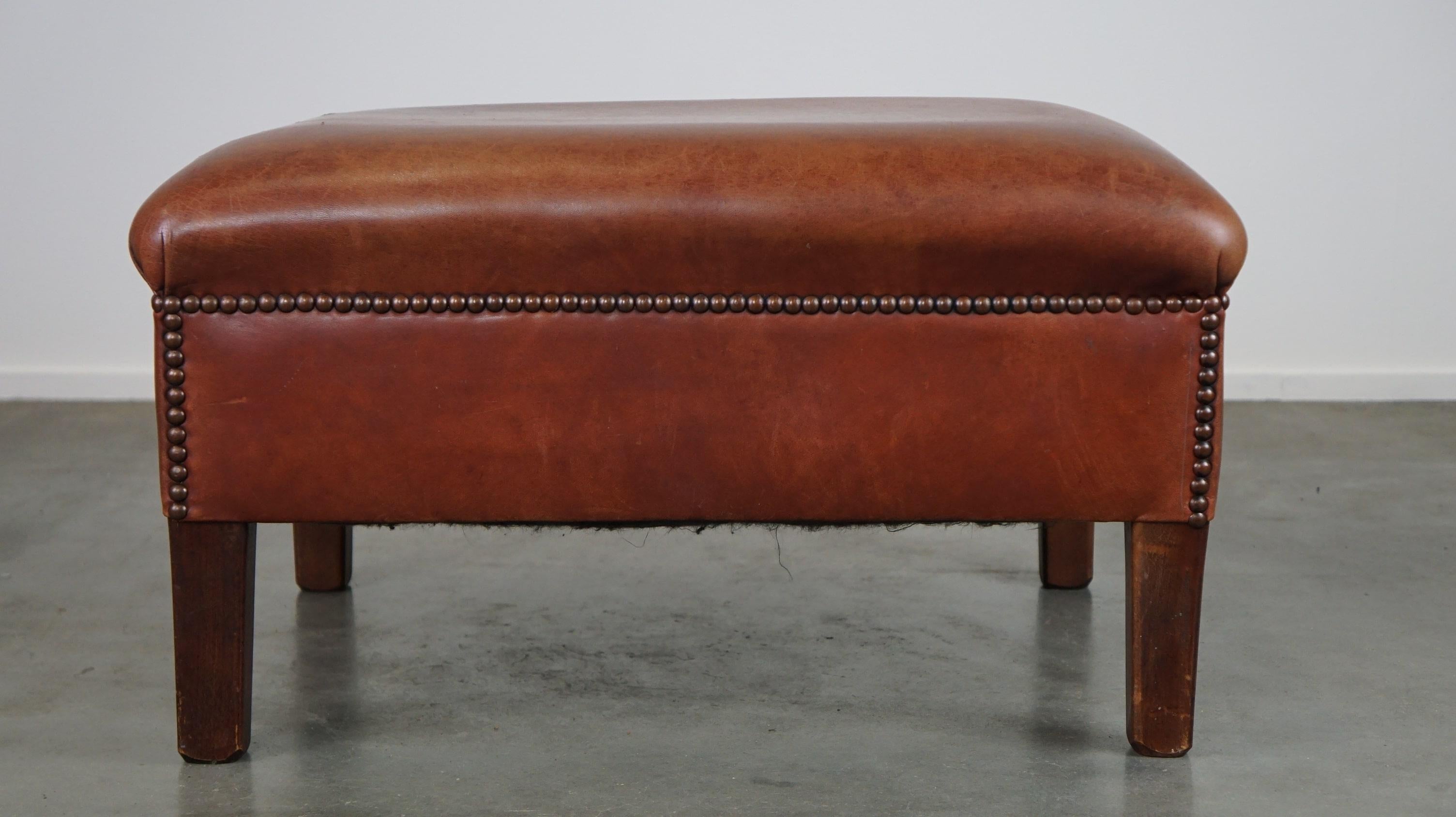 Leather ottoman in classic English style finished with decorative nails ...