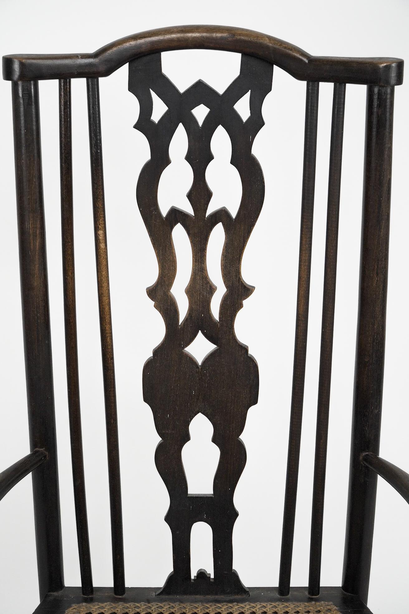 Liberty and Co attributed. A Queen Anne style fretwork back cane seat ...
