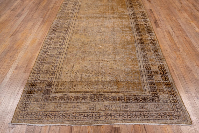 Lightly Distressed Gold Antique Khotan Rug, circa 1910s For Sale at 1stDibs