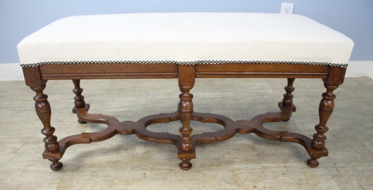 Long Oak Stool with Turned Legs and Criss-Cross Stretcher Base at 1stDibs