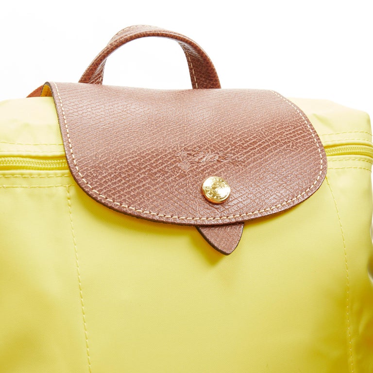LONGCHAMP Le Pliage yellow nylon brown canvas trim foldaway backpack ...