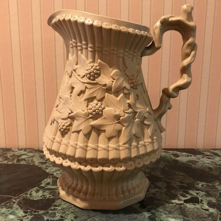 Lot of Four Stoneware and Ceramic Relief Pitchers at 1stDibs
