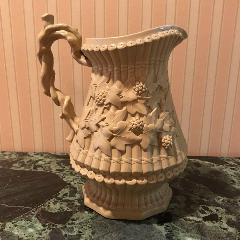Lot of Four Stoneware and Ceramic Relief Pitchers at 1stDibs