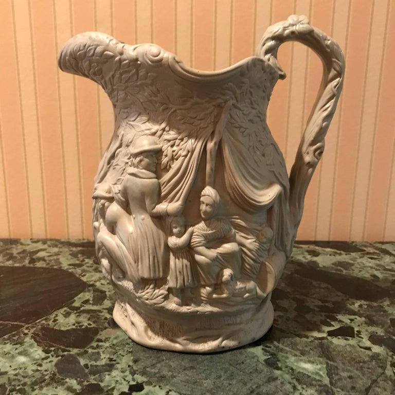 Lot of Four Stoneware and Ceramic Relief Pitchers at 1stDibs