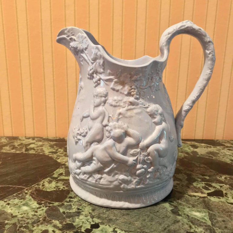 Lot of Four Stoneware and Ceramic Relief Pitchers at 1stDibs