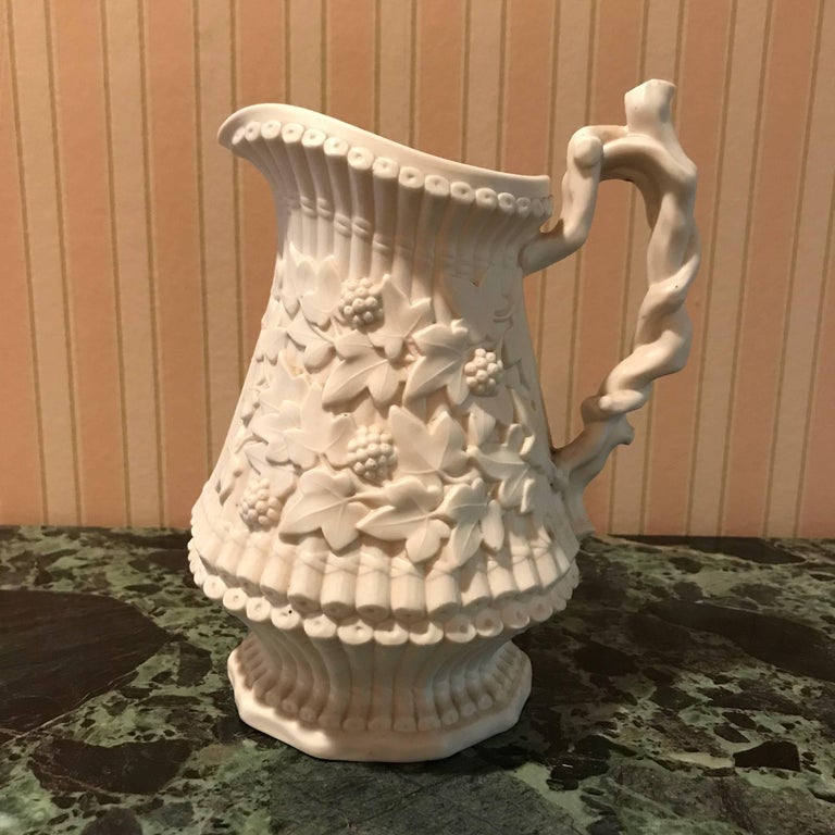 Lot of Four Stoneware and Ceramic Relief Pitchers at 1stDibs