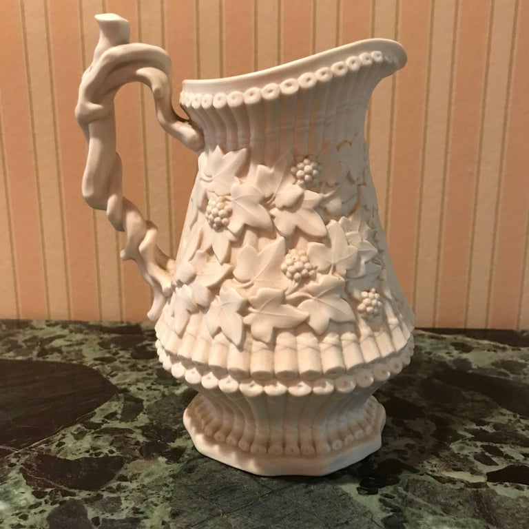 Lot of Four Stoneware and Ceramic Relief Pitchers at 1stDibs