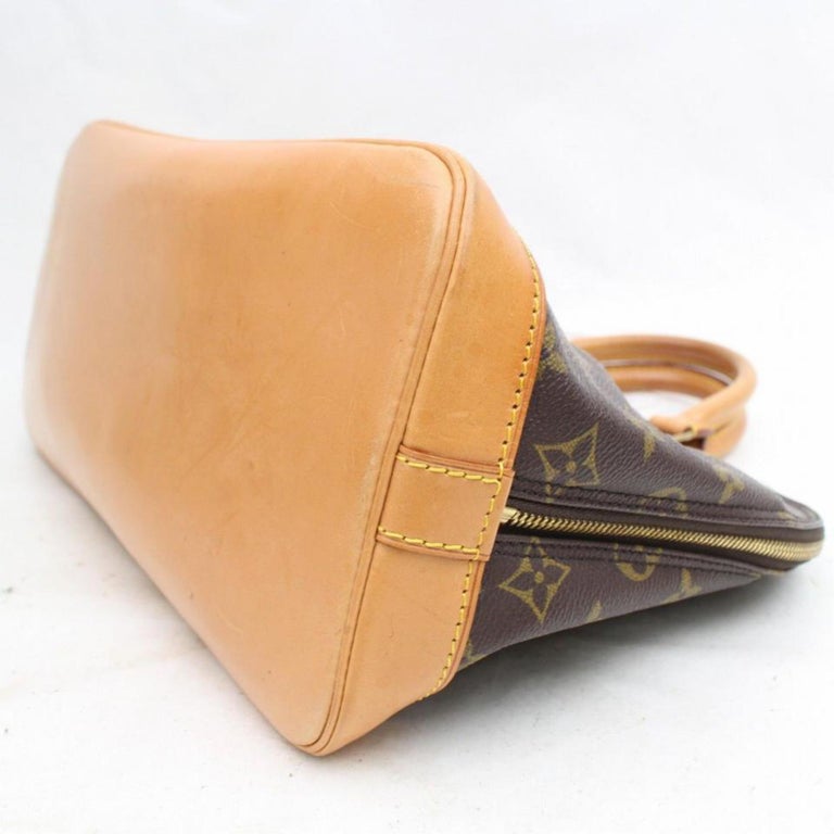 Louis Vuitton Alma Monogram Pm 868786 Brown Coated Canvas Satchel For Sale at 1stDibs