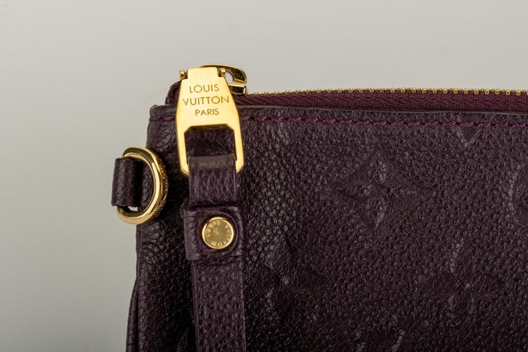 Louis Vuitton Burgundy Logo Embossed Pouchette Bag at 1stDibs