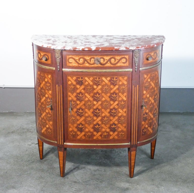 Louis XVI style half- moon sideboard in richly inlaid wood in various ...