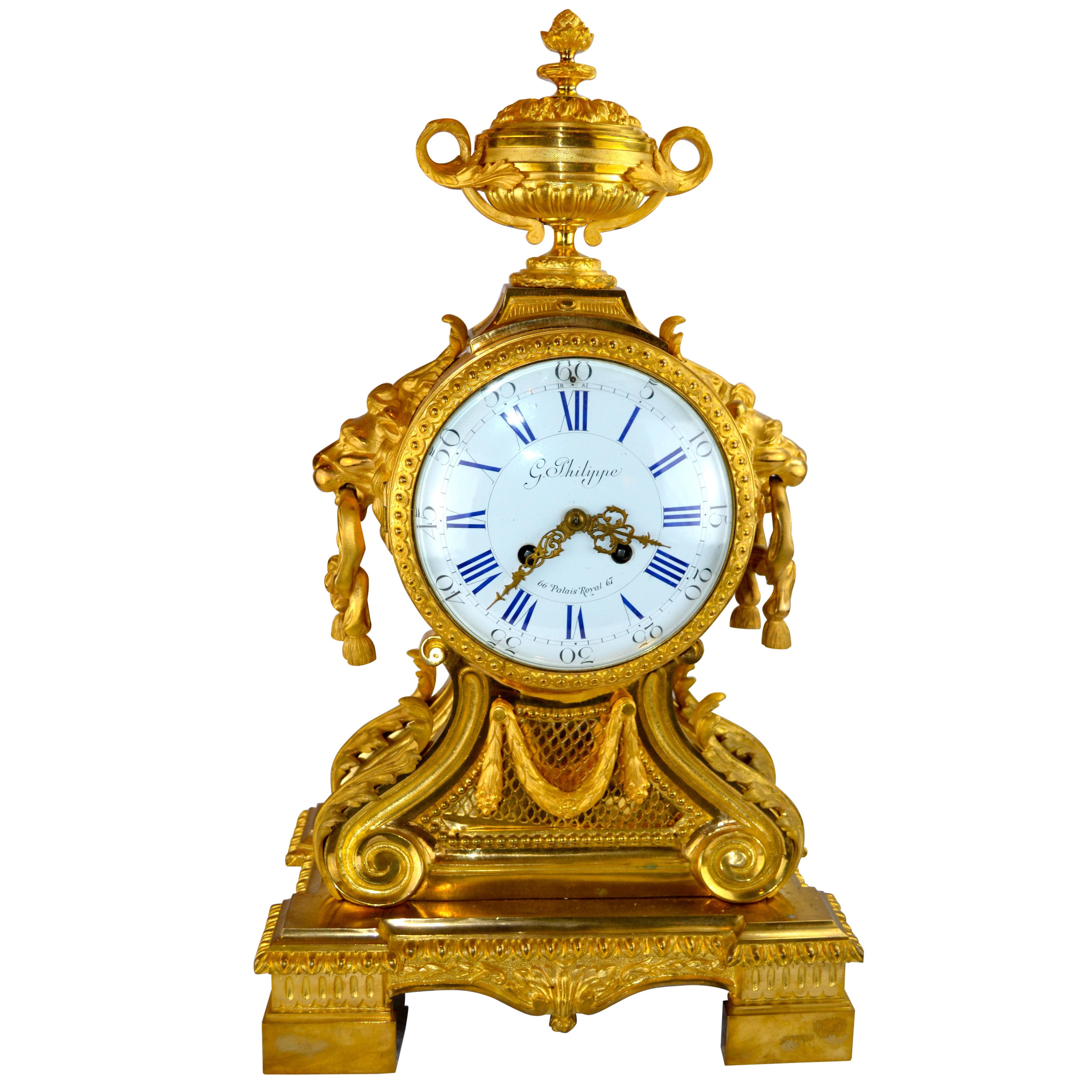 Louis XVI Style Urn and Lions Head Clock at 1stDibs