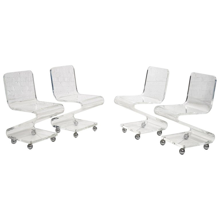 Lucite Chairs on Casters, circa 1970 For Sale at 1stDibs