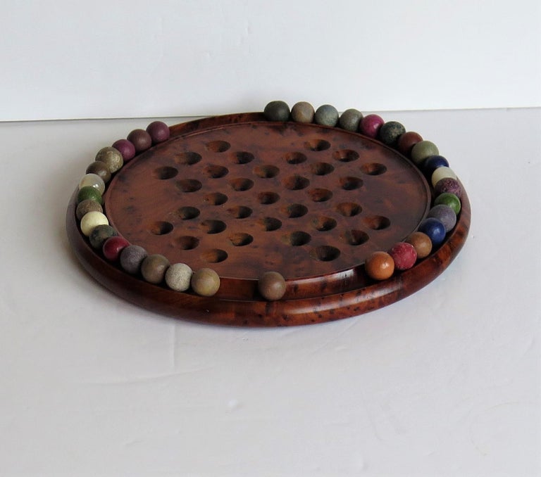 Marble Solitaire Board Game with 33 Early Handmade Stone Marbles, circa ...