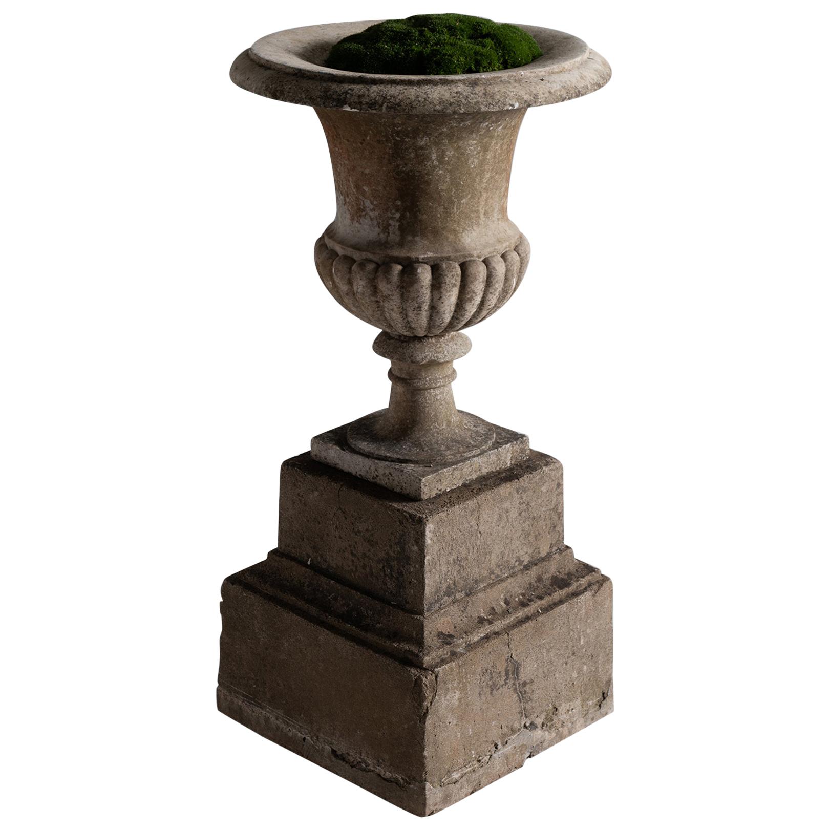 Set of Four Large English Stone Urns on Plinths at 1stDibs