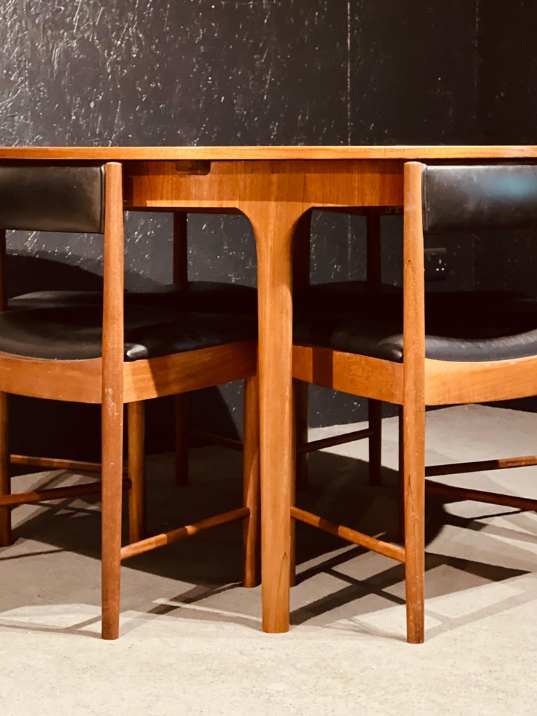 McIntosh Round Extending Teak Dining Table and Chairs in Black Vinyl ...