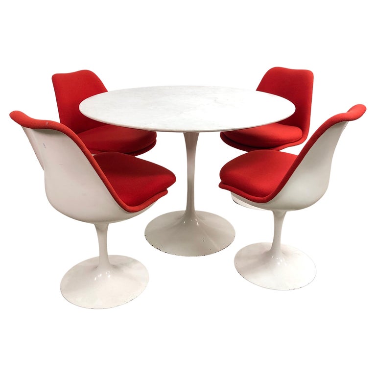 Mid Century Eero Saarinen Swivel Tulip Chairs and Early Cast Iron Dining Table For Sale at 1stDibs