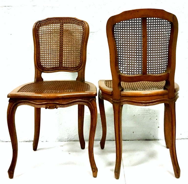Mid-Century Pair Of French Style Carved Wood and Cane Chairs For Sale ...
