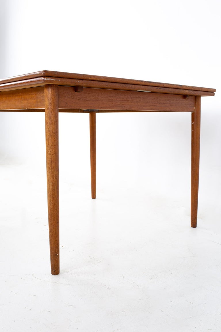 Mid Century Teak Hidden Leaf Expanding Dining Table at 1stDibs