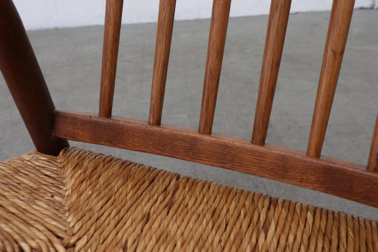 Midcentury Teak Spindle Back Rocking Chair with Rush Seat at 1stDibs