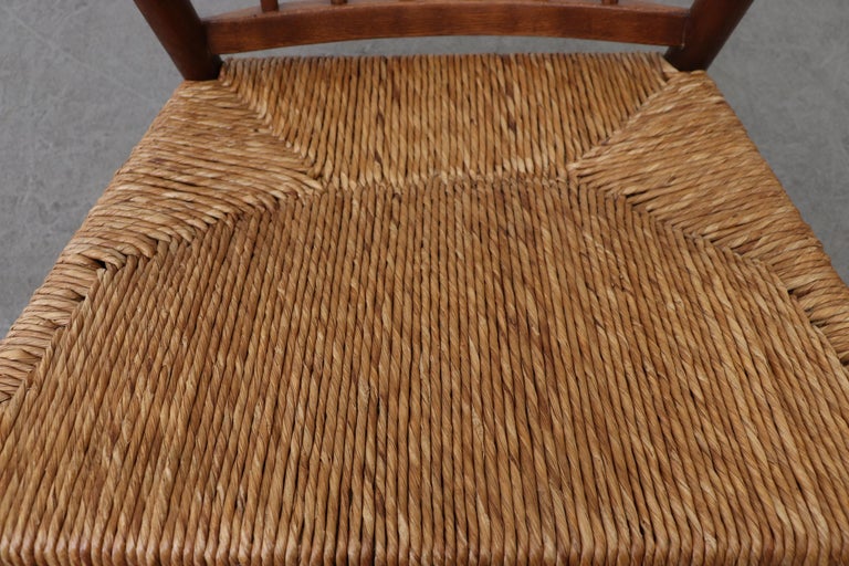 Midcentury Teak Spindle Back Rocking Chair with Rush Seat at 1stDibs