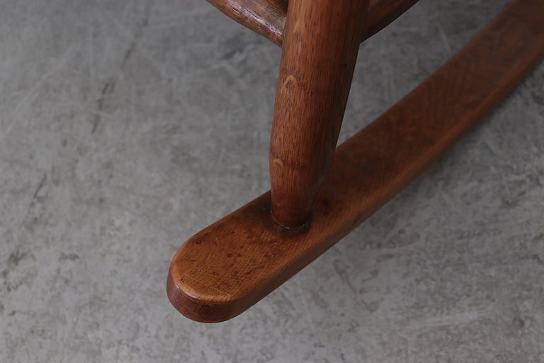 Midcentury Teak Spindle Back Rocking Chair with Rush Seat at 1stDibs