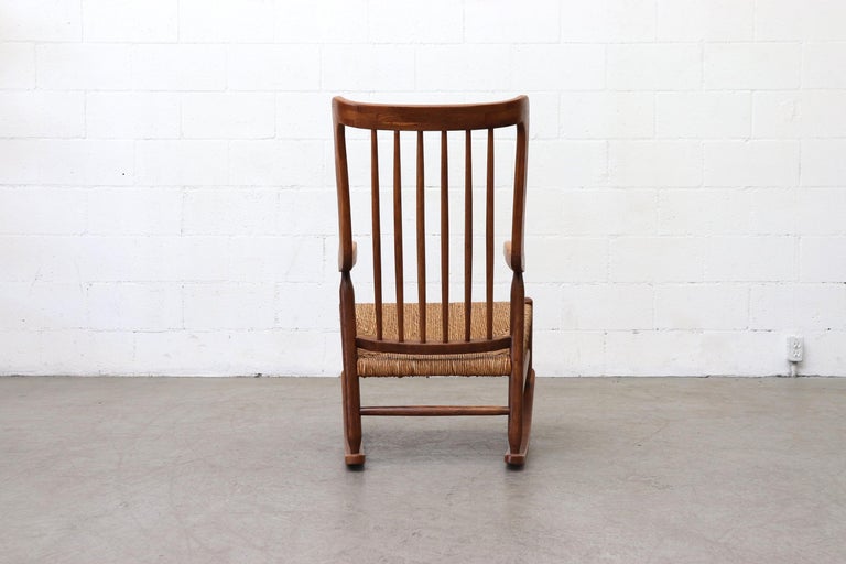 Midcentury Teak Spindle Back Rocking Chair with Rush Seat at 1stDibs